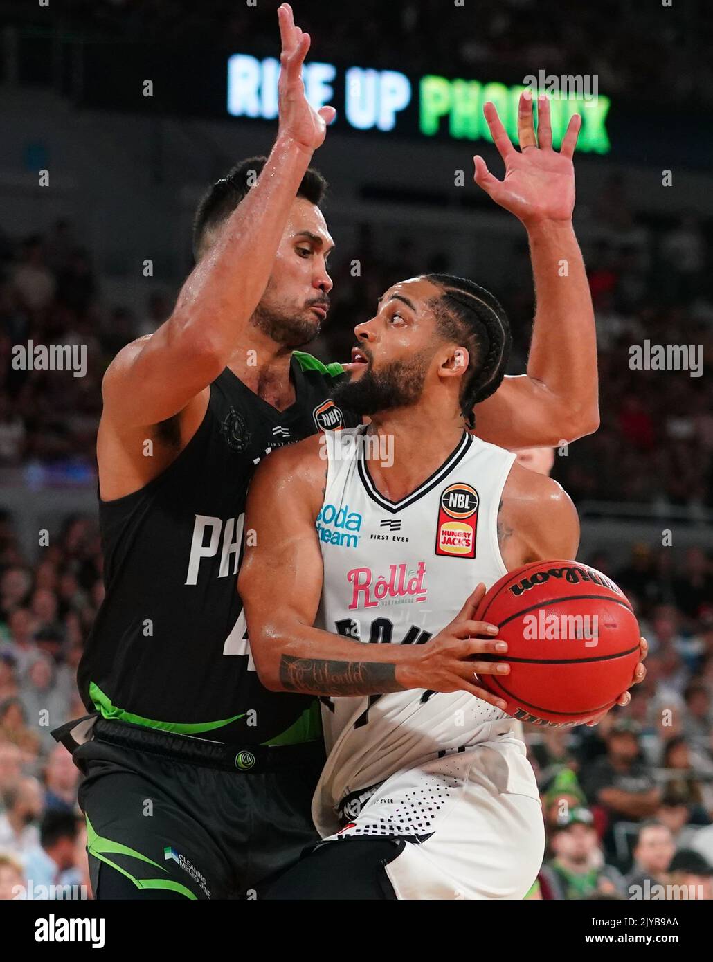 Melo Trimble of Melbourne United drives to the basket as Tai Wesley of ...