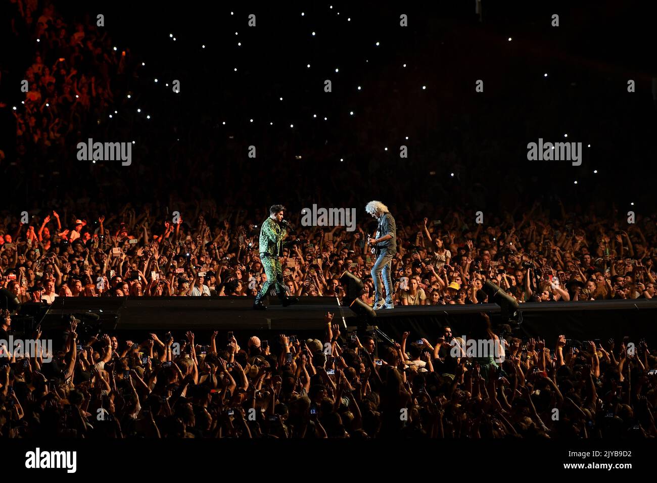 Brian May (right) and Adam Lambert of Queen performs during the Fire ...