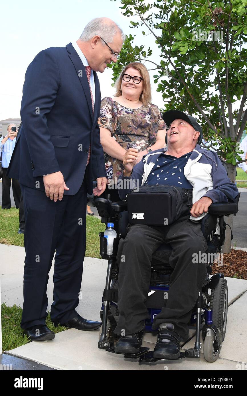Prime Minister Scott Morrison joins resident Ricky Hackett during a ...