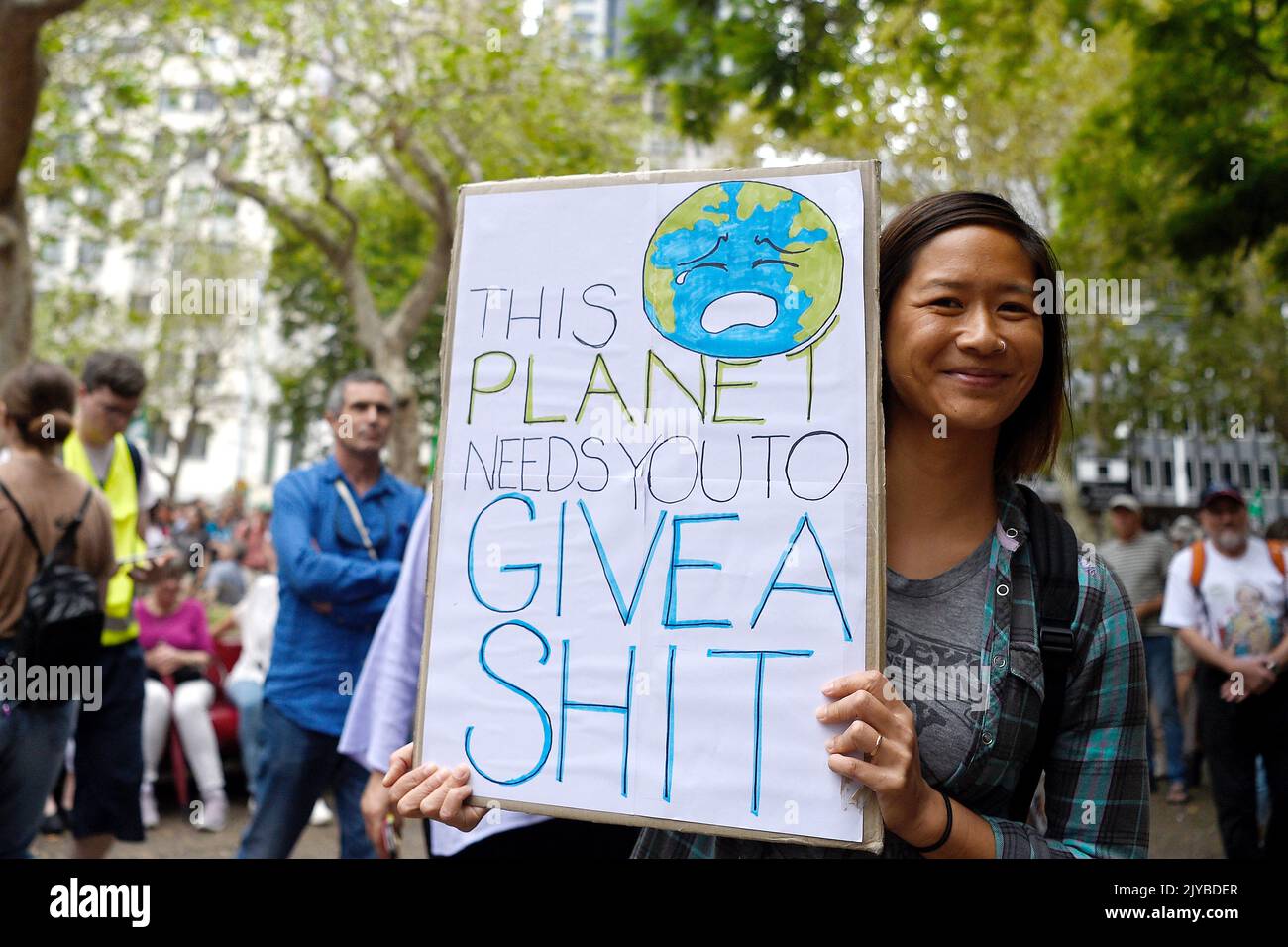 Protesters hold placards during the Climate Crisis National Day of ...