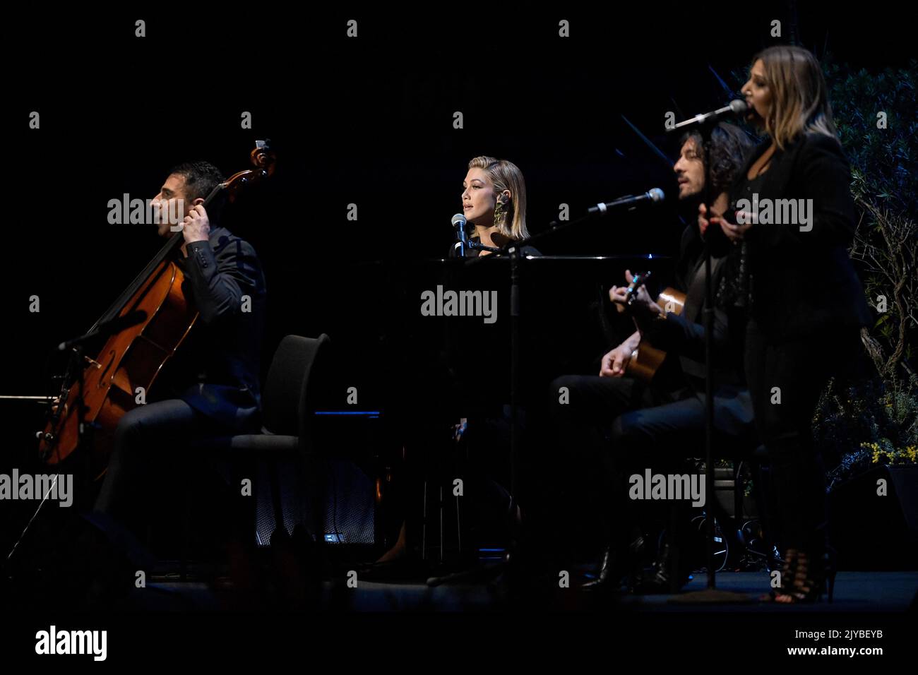 Australian seer Delta Goodrem (centre) performs during a Bushfire State ...