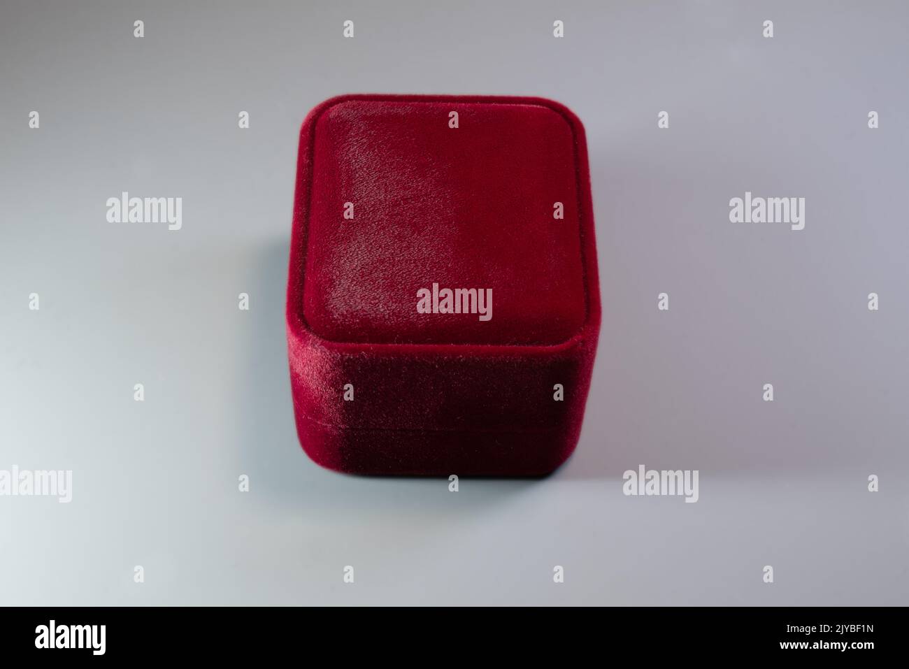 Red box for jewelry. Isolated on grey Stock Photo - Alamy