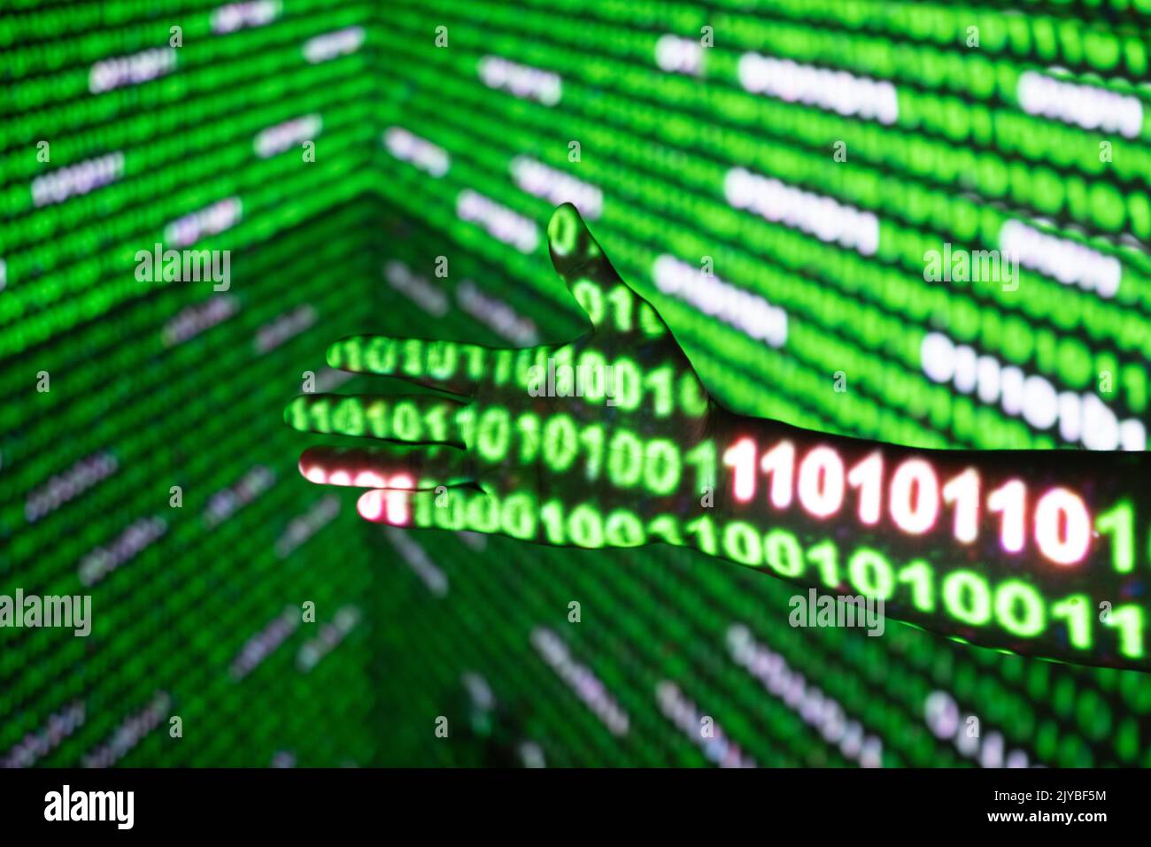 Close up of the data,Binary code，Green binary code on black screen and hand Stock Photo - Alamy