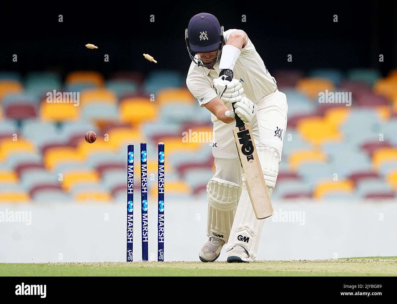 Bushrangers batsman Jonathan Merlo is bowled out by Queensland bowler ...