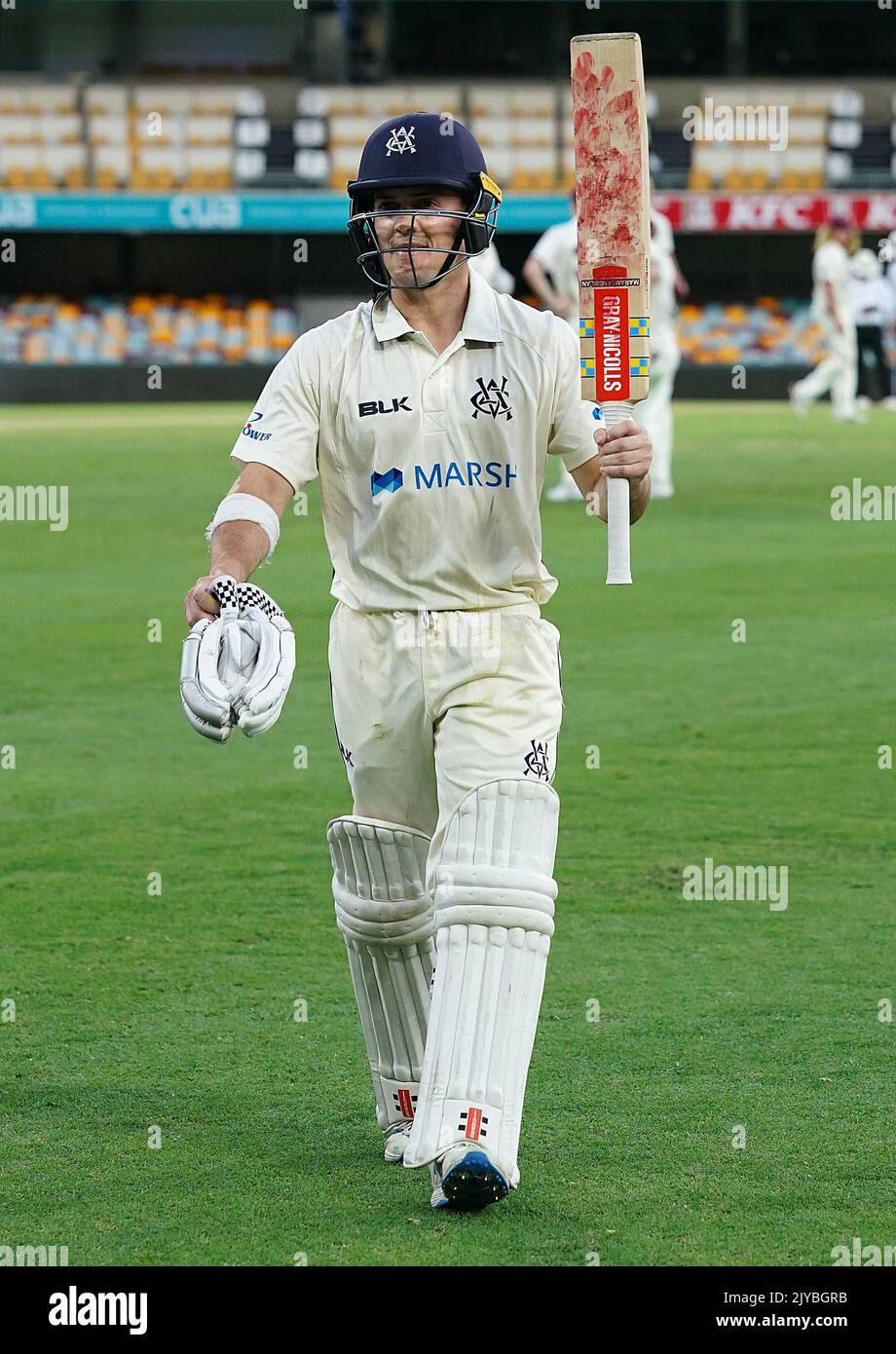 Bushrangers batsman Sam Gotch raises his bat as he leaves the field at ...