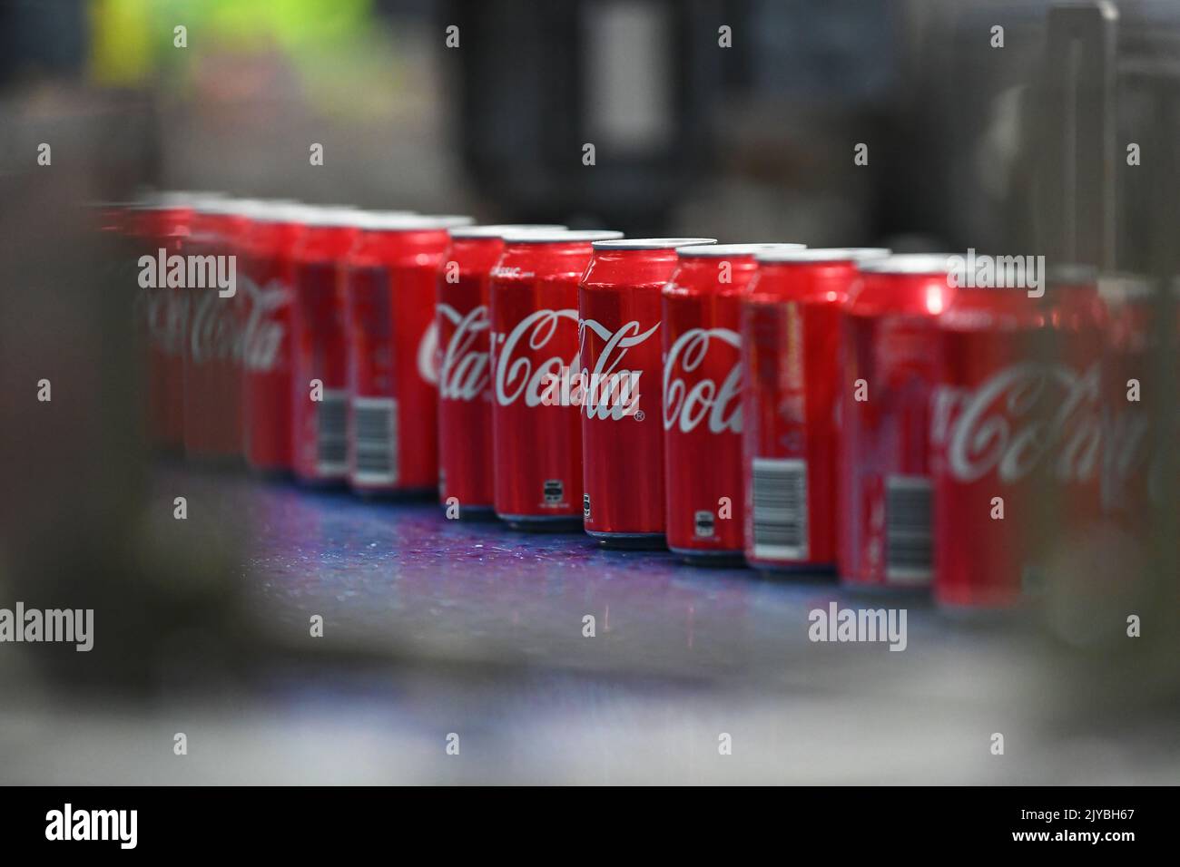 Cans of coke are seen on the production line at the Coca Cola factory ...