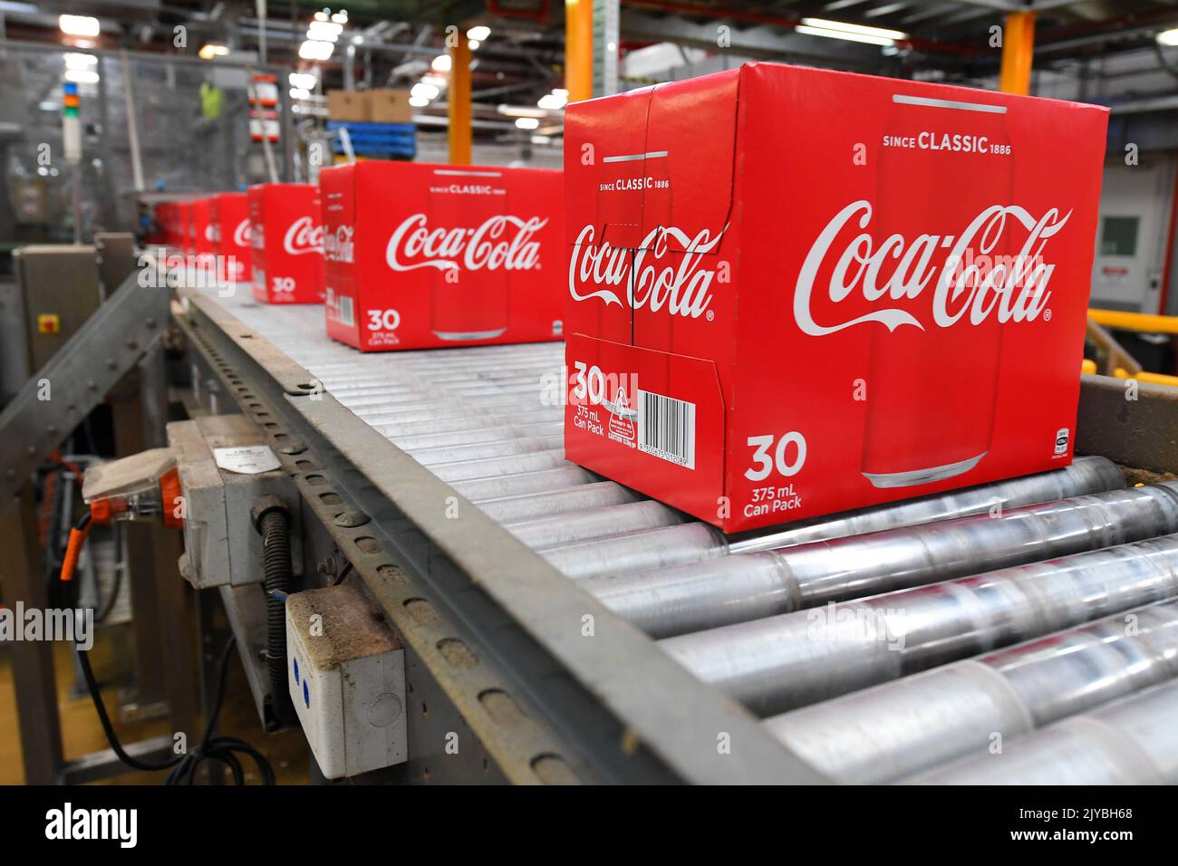 Boxes of coke are seen on the production line at the Coca Cola factory ...