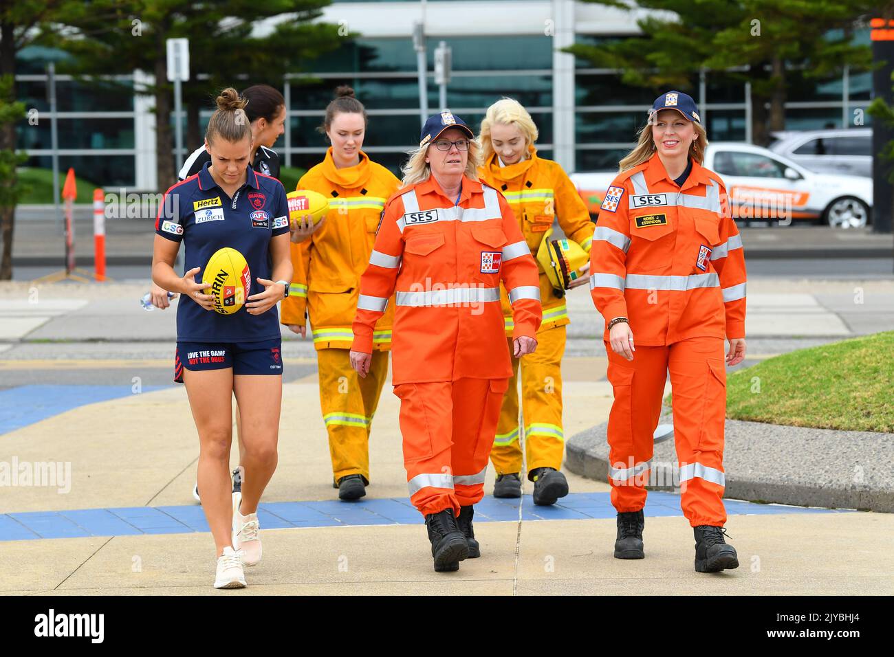 Maddi Gay (left) of the Demons arrives to a press conference with CFA ...
