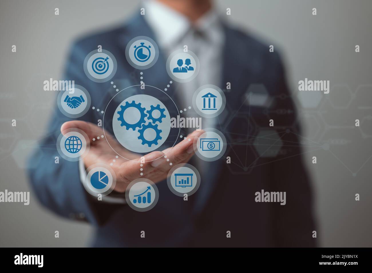 With gears and icons in the backdrop and a connecting line network, a ...