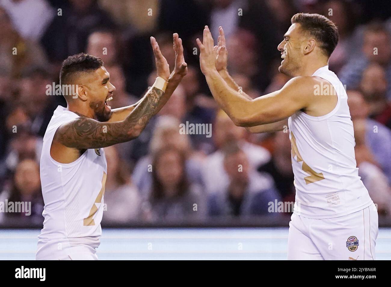 Stephen Coniglio of the Allstars (Right) celebrates a goal with Michael ...