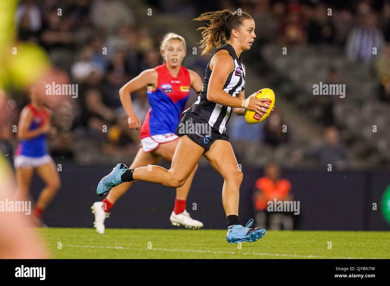 Chloe Molloy of the Magpies charges into the forward 50 during the ...