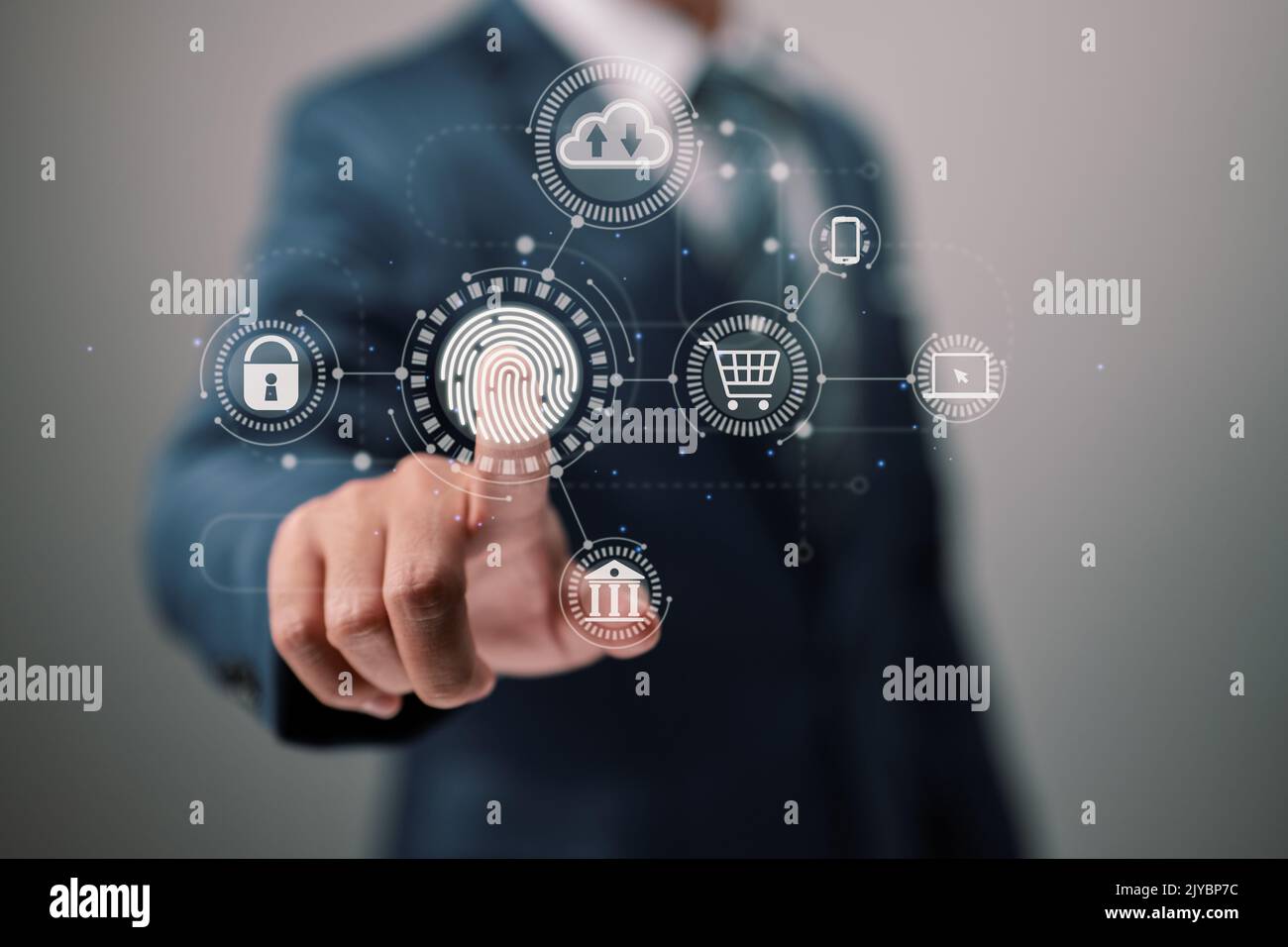On a virtual screen, a businessman touches a fingerprint scanner to ...