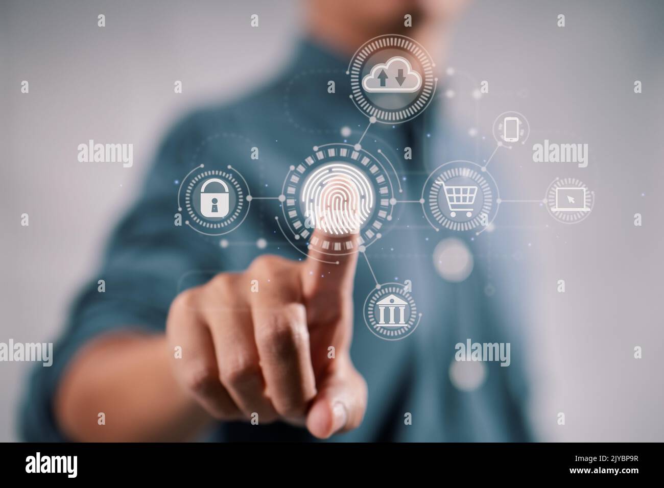 On a virtual screen, a businessman touches a fingerprint scanner to ...