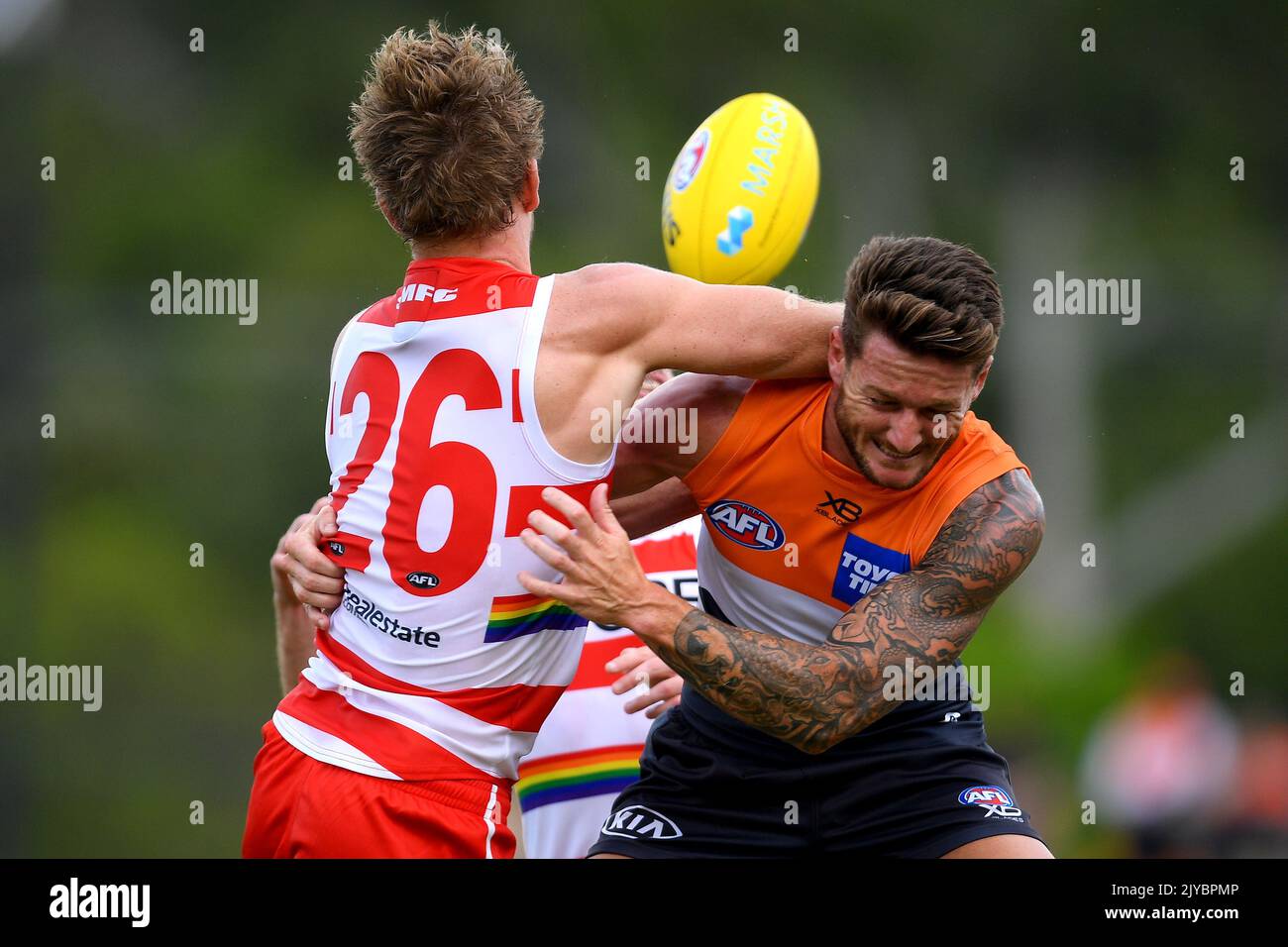Luke Parker of the Swans contests for the ball with Daniel Lloyd of the ...