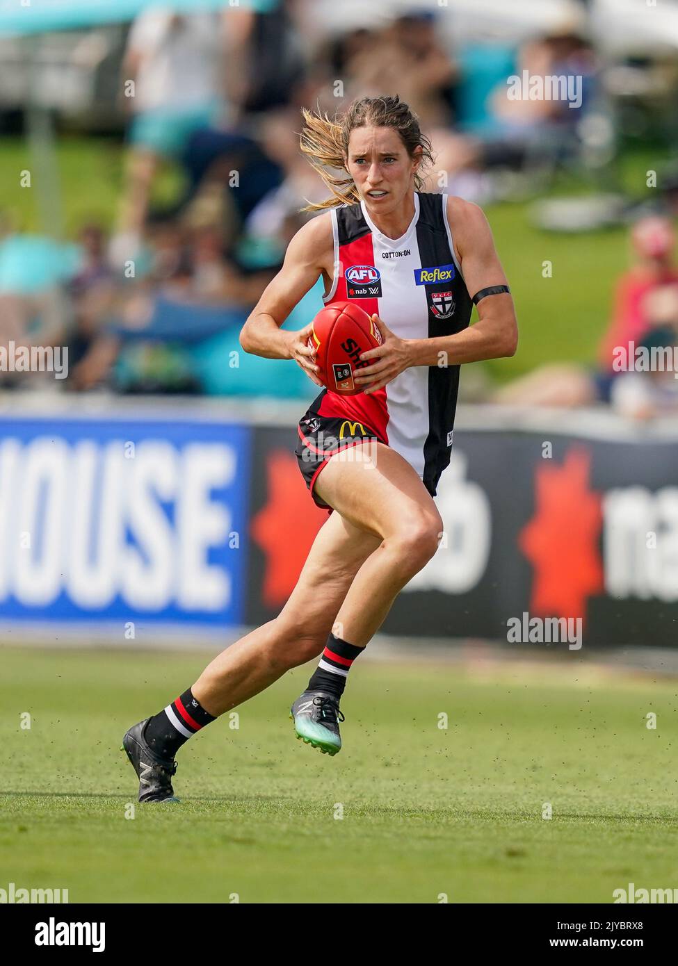 Catherine Phillips of the Saints runs with the ball during the Round 4 ...