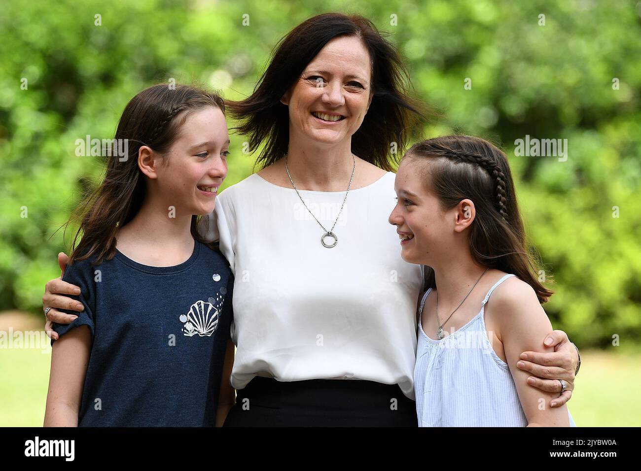 10-year-old Rosie Baxter (right), who an influenza at age four, poses ...