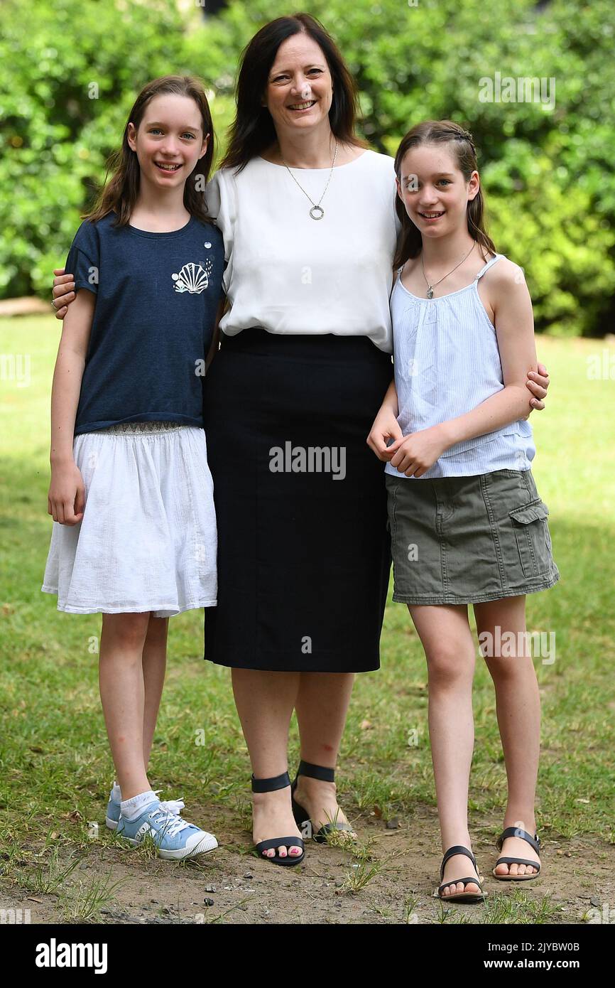 10-year-old Rosie Baxter (right), who an influenza at age four, poses ...