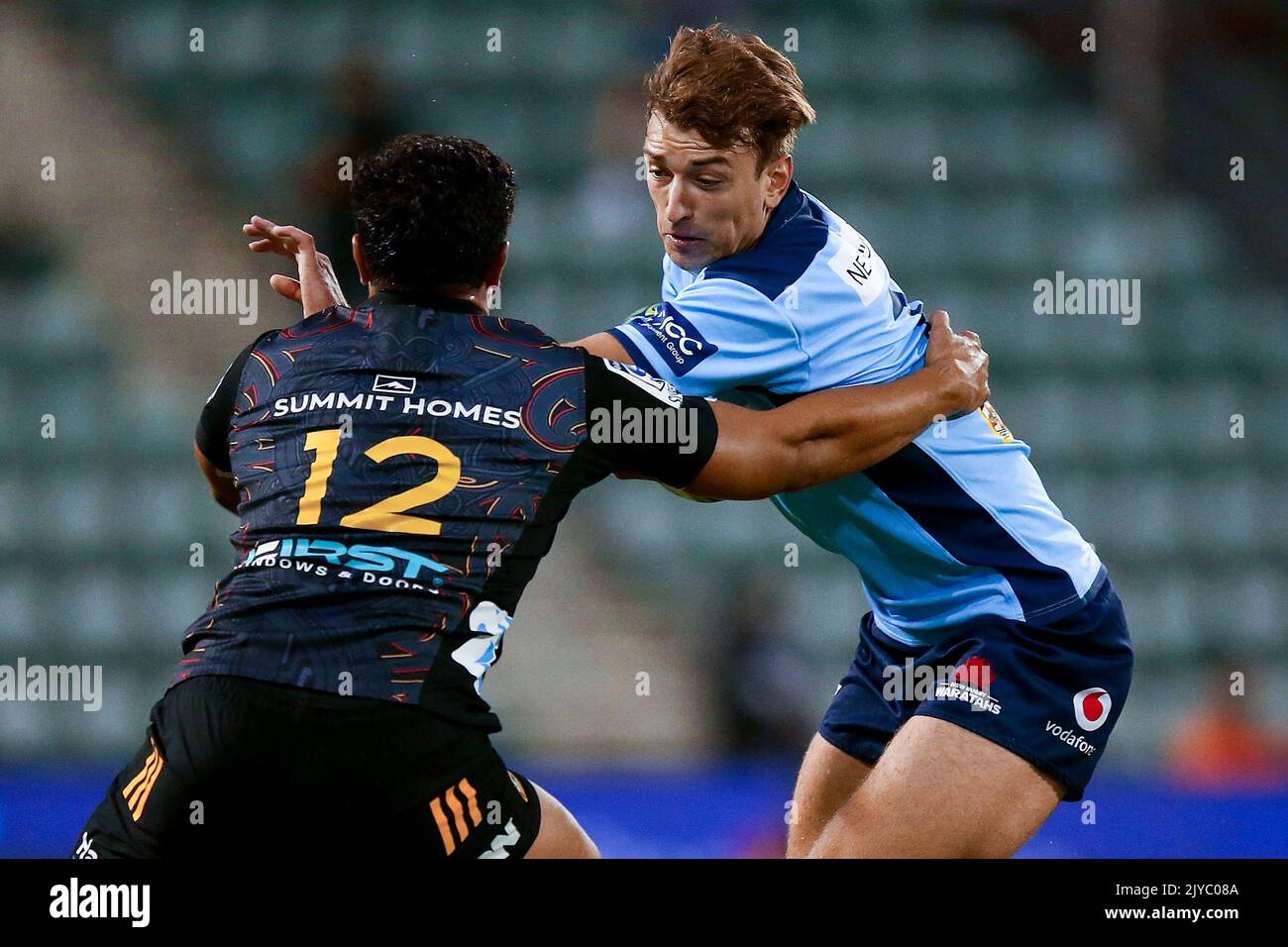 James Ramm of the Waratahs is tackled during the Round 6 Super Rugby ...