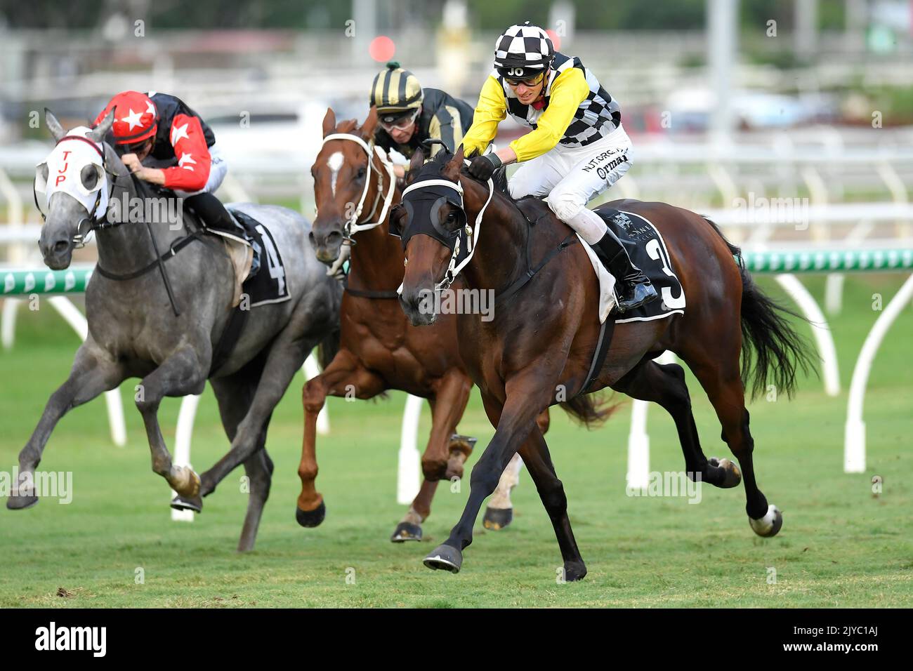 Jockey James Orman rides Ballistic Boy (right) to victory in race 9 ...