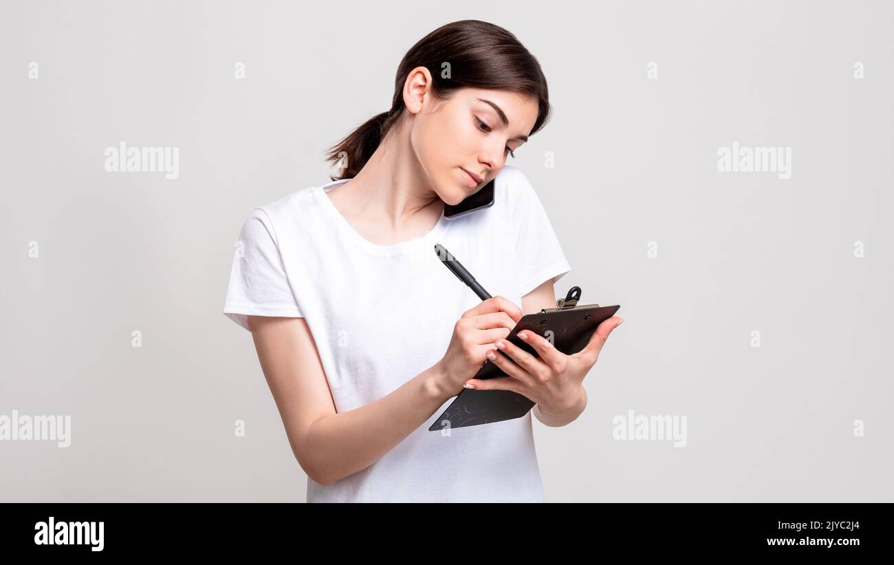 business call reservation list woman clipboard Stock Photo - Alamy