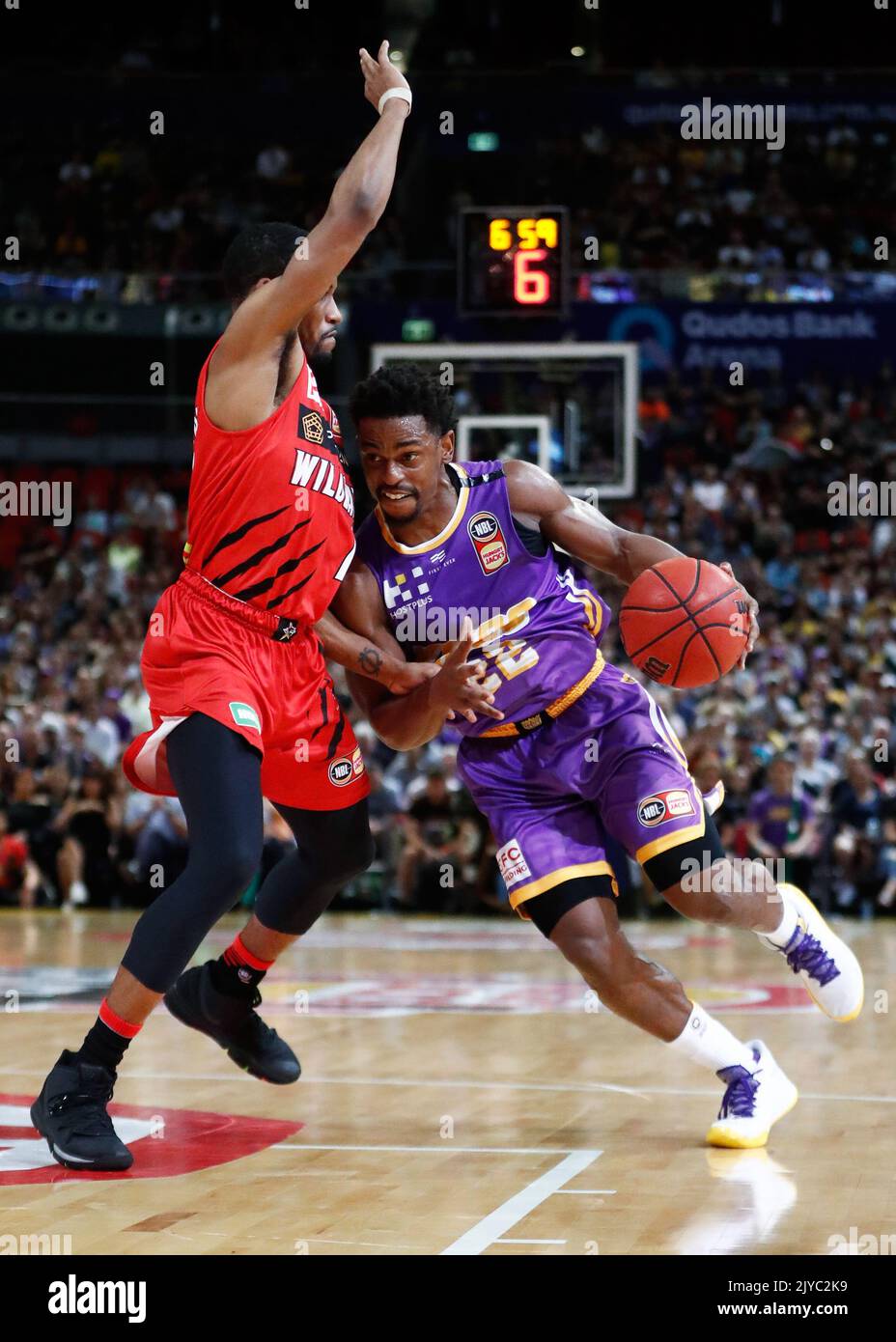 Casper Ware of the Kings competes with Bryce Cotton of the Wildcats ...