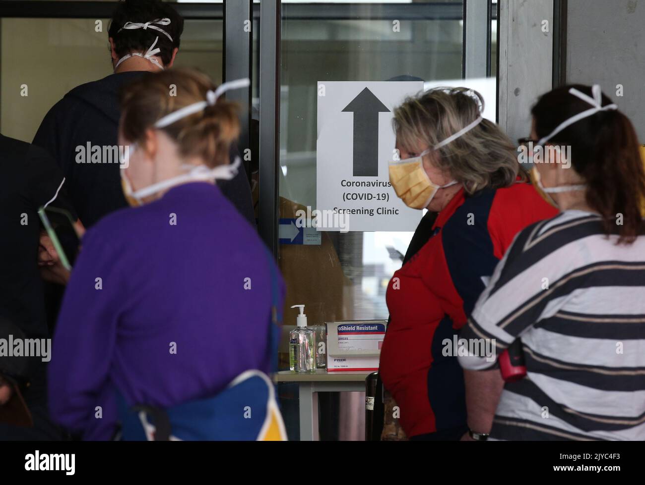 People line up outside the Royal Melbourne Hosital for coronavirus ...