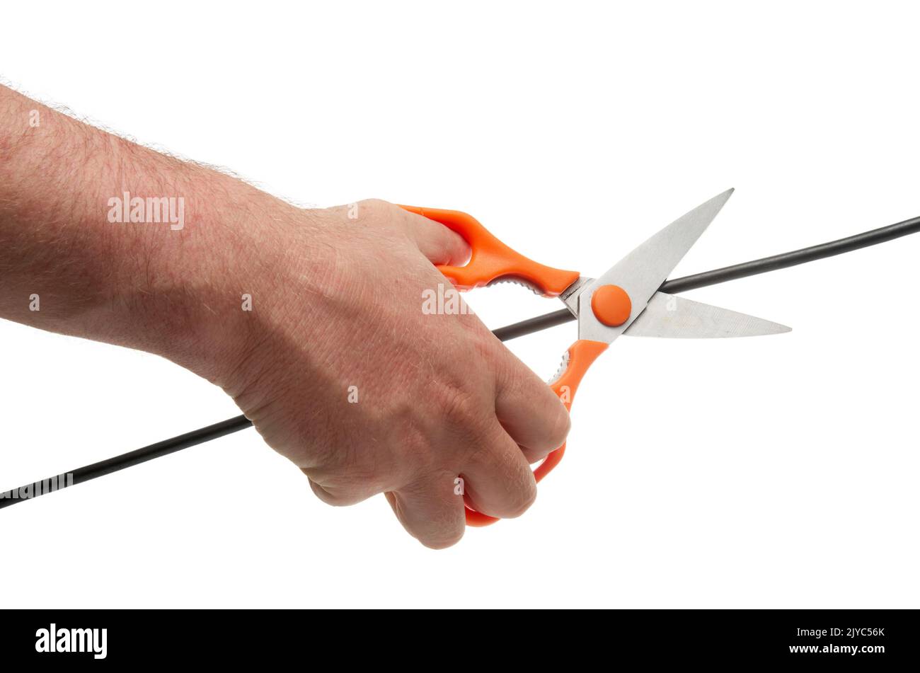 Human hand with scissors cuts a black wire Stock Photo - Alamy