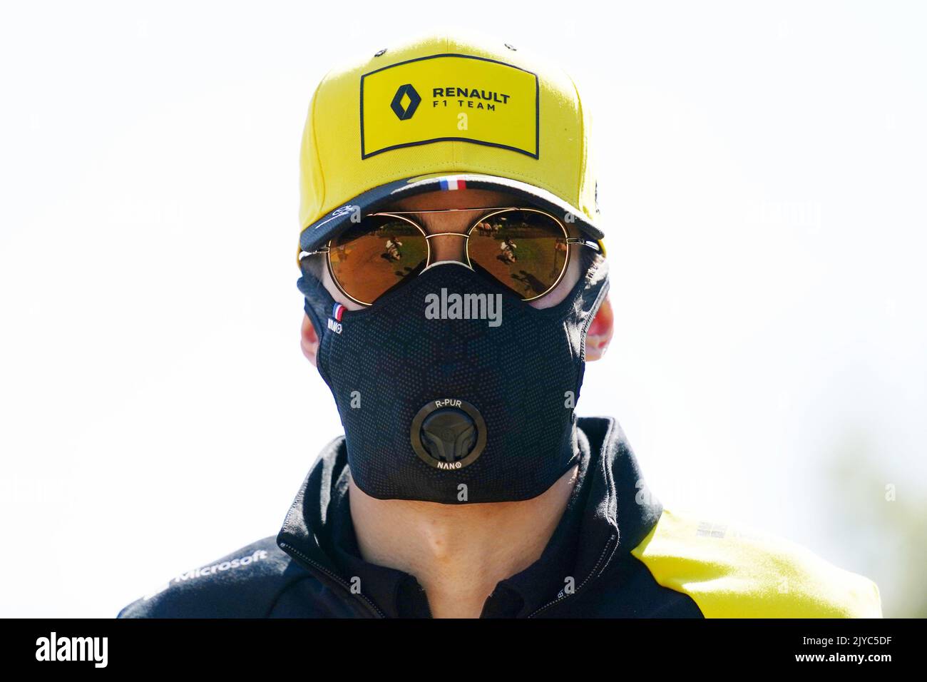 Esteban Ocon of Renault arrives with a face mask ahead of the Formula 1 ...