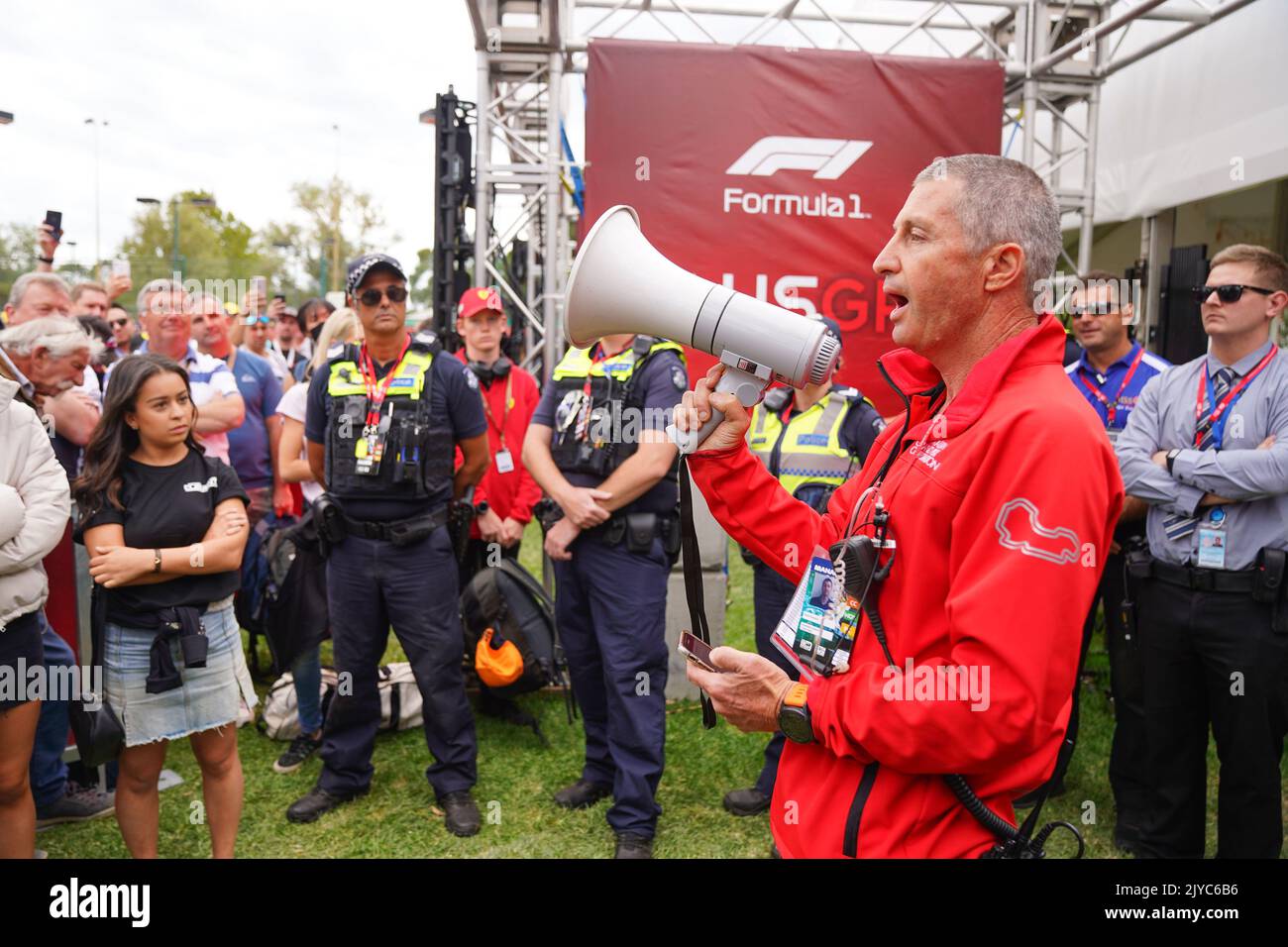 David Simpson, an official from the The Australian Grand Prix Corporation announces to the crowd ...