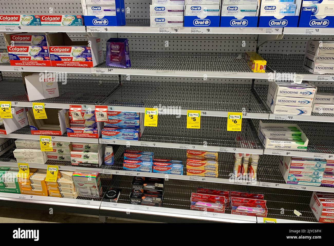 Half full shelves of toothpaste are seen at Woolworths Town Hall in ...