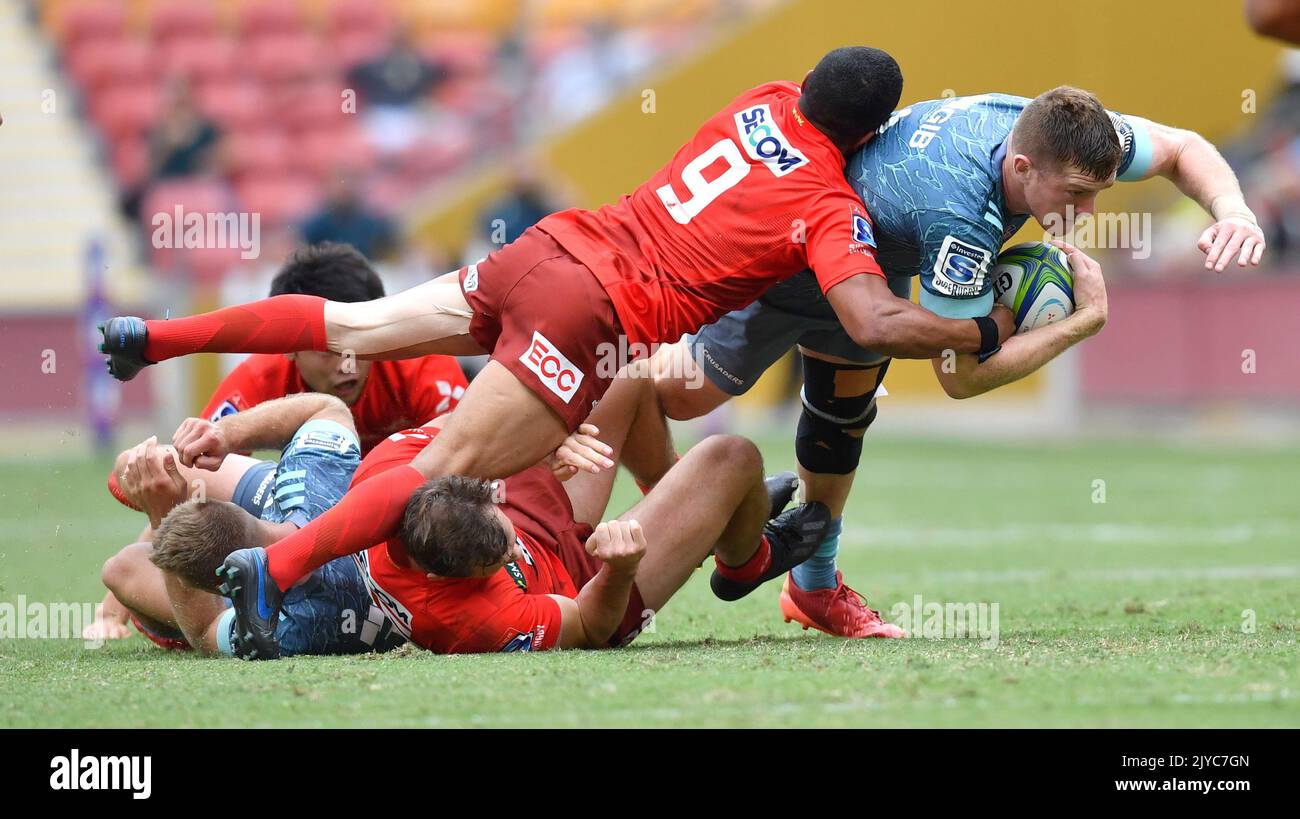 Dallas McLeod (right) of the Crusaders is tackled by Rudy Paige of the ...