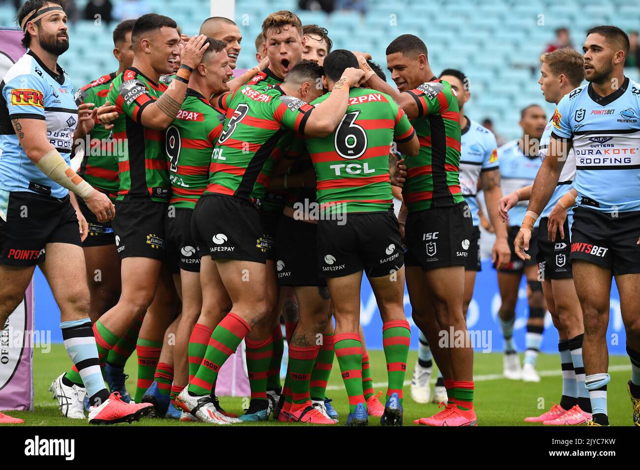 The Rabbitohs celebrate Adam Reynolds' try during the Round One NRL ...
