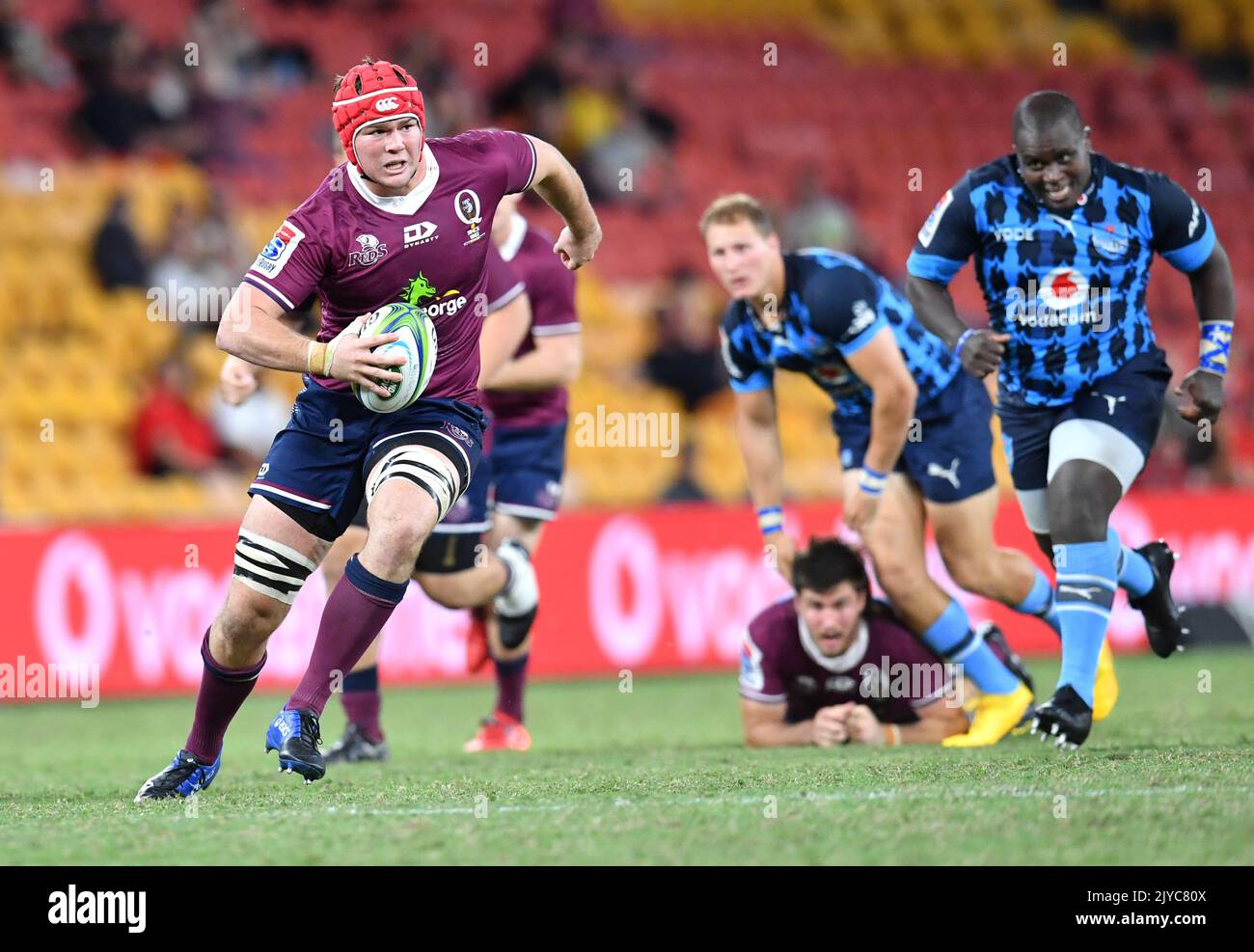 Harry Wilson (left) of the Reds makes a break during the Round 7 Super ...