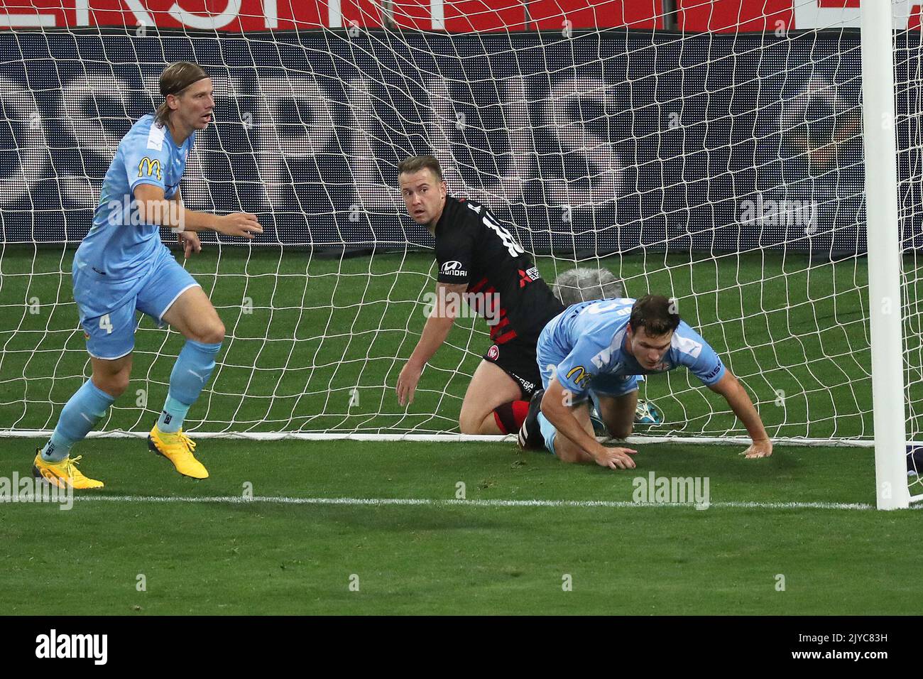 Curtis Good of Melbourne City slides in to stop Simon Cox of Western ...