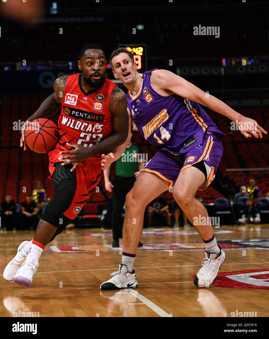 Terrico White of the Wildcats under pressure from Daniel Kickert of the ...