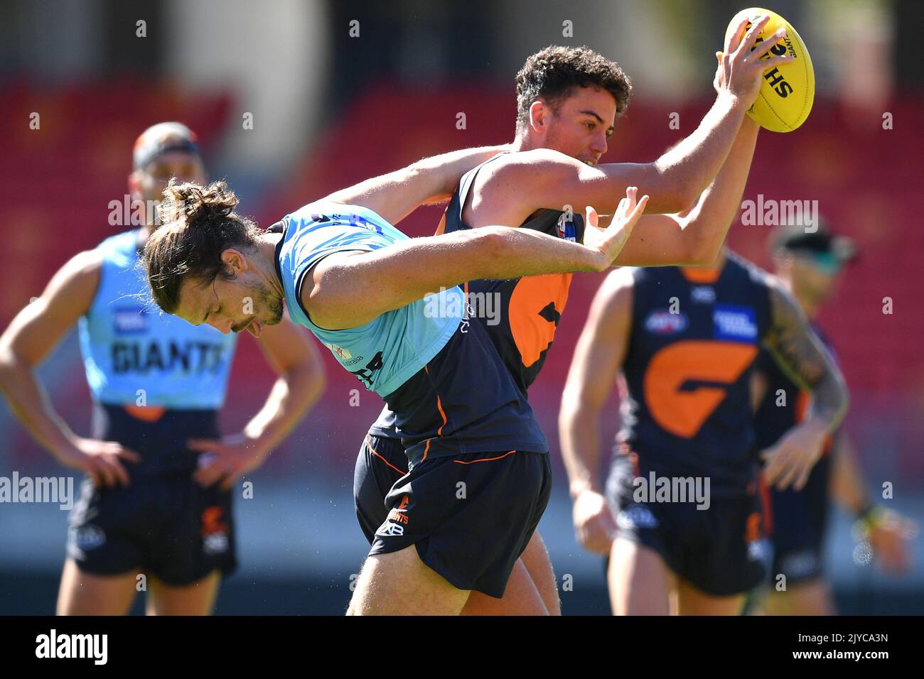 Phil Davis (left) and Jake Riccardi of the Giants take part in a ...