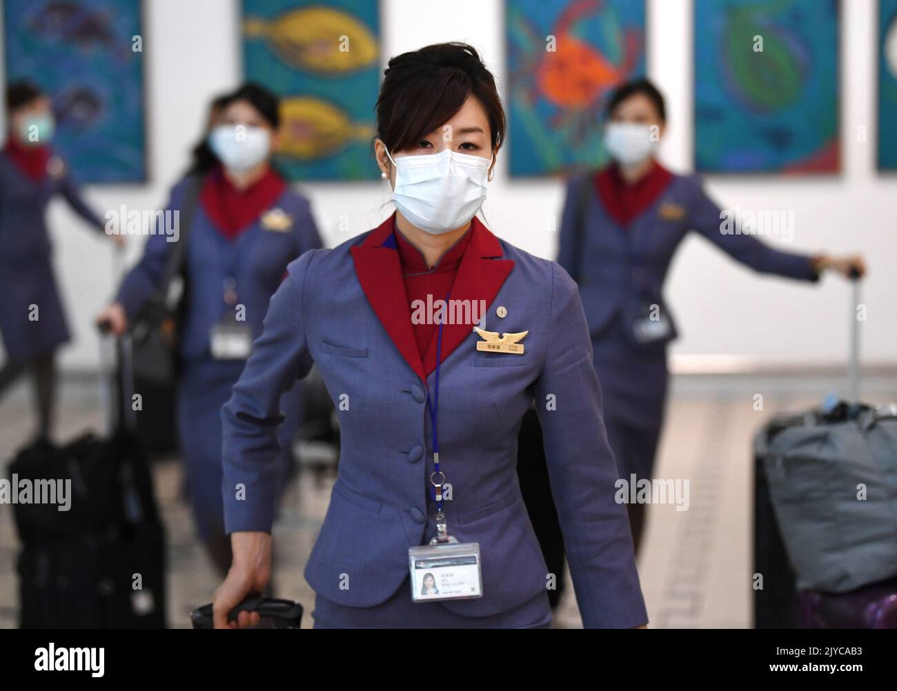 Cabin crew from China Airlines is seen wearing face masks on arrival at ...