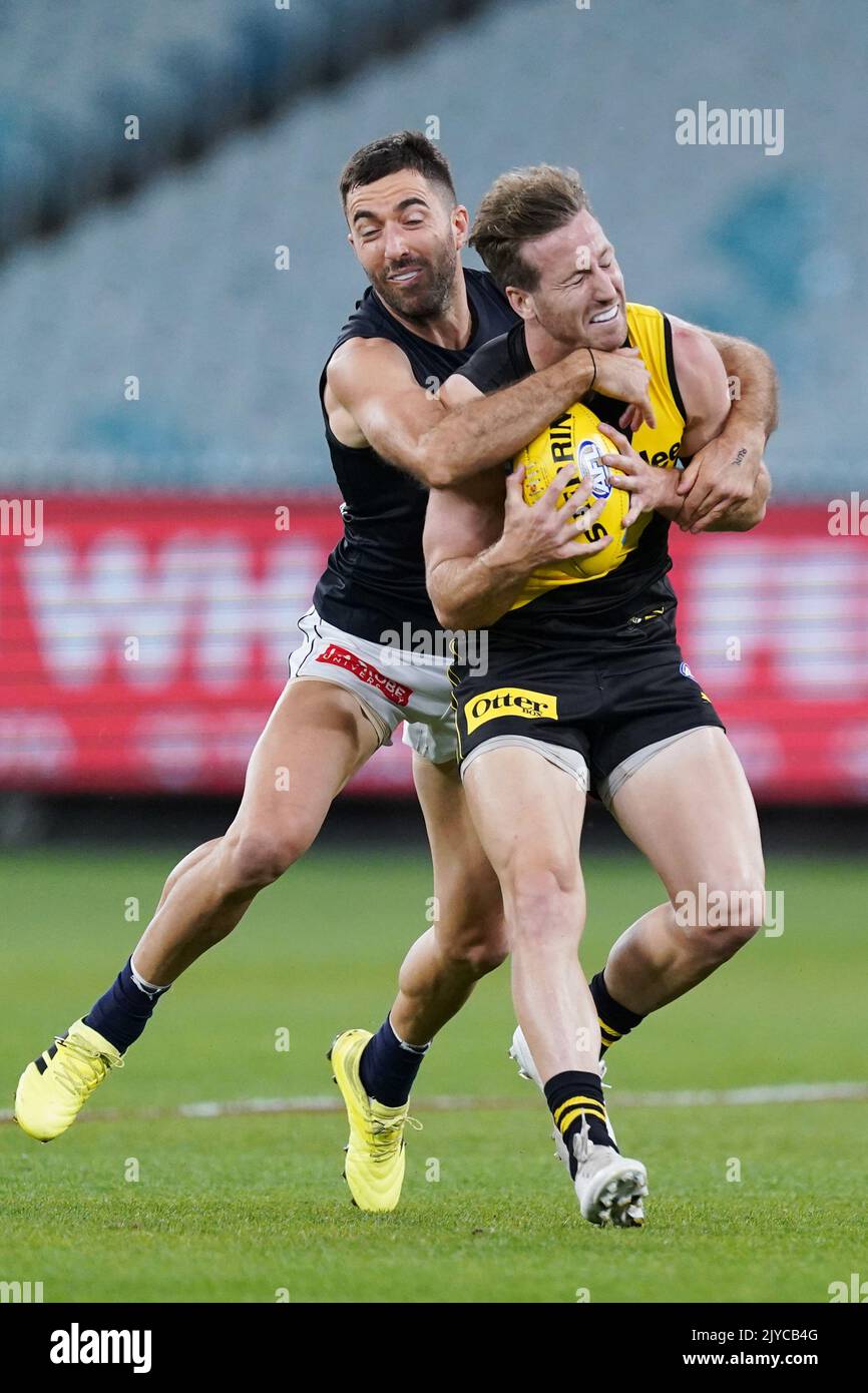 Kade Simpson of the Blues tackles Kane Lambert of the Tigers during the ...
