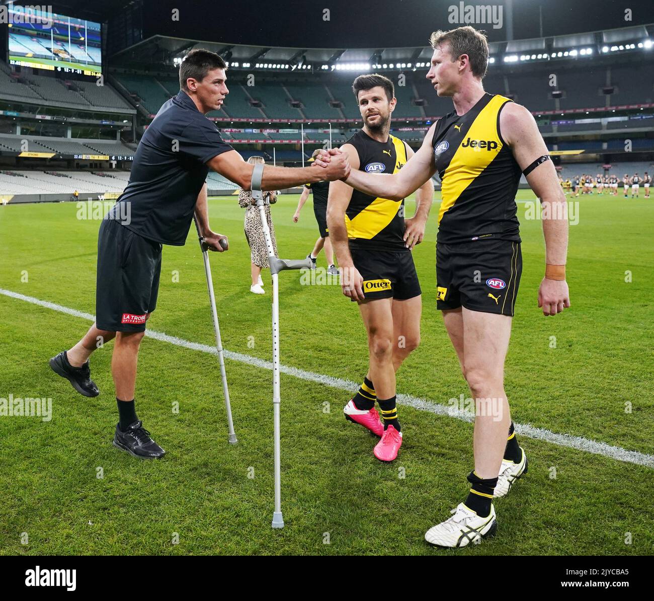 Matthew Kreuzer of the Blues is wished well by Dylan Grimes of the ...