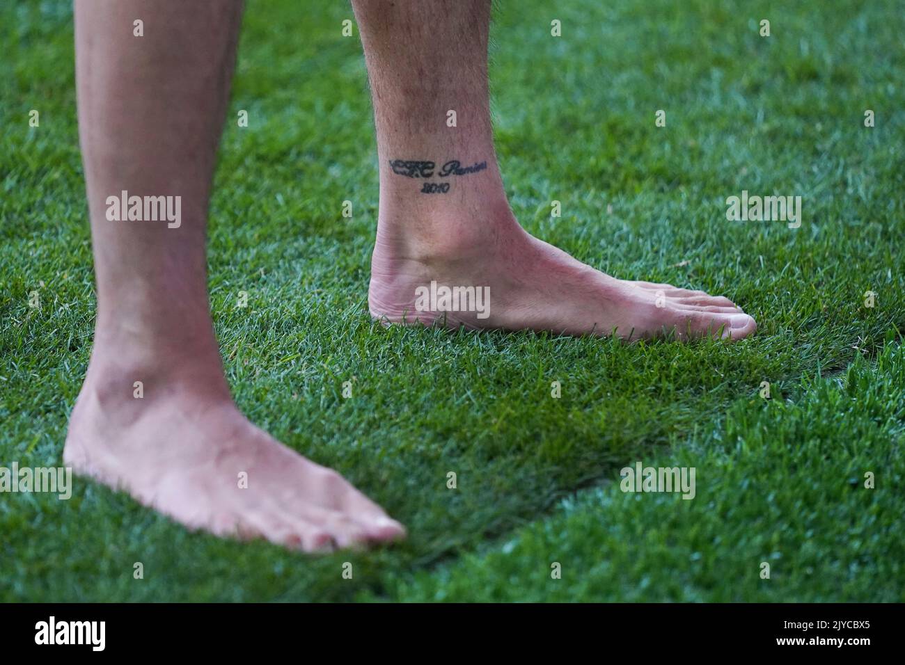 The 2010 premiership tattoo is seen on Scott Pendlebury of the Magpies ...