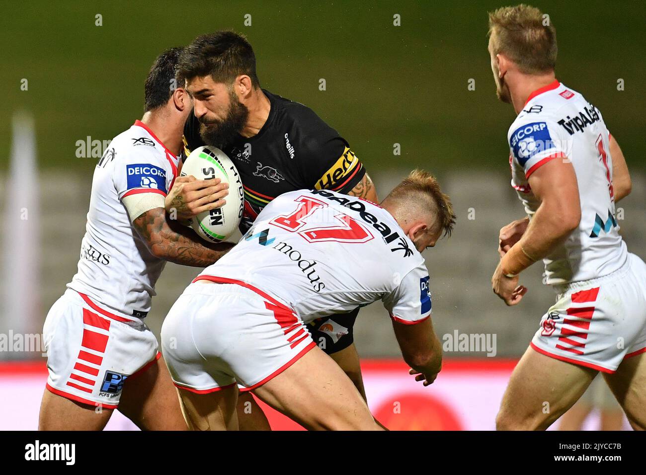 James Tamou of the Panthers is tackled by Jacob Host of the Dragons ...