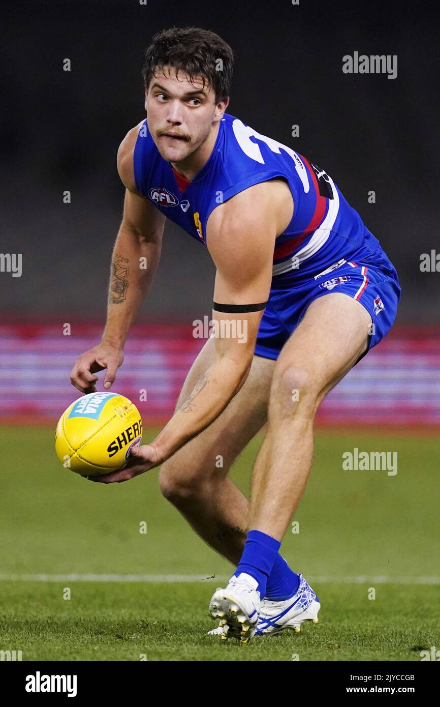 Bailey Williams of the Bulldogs handballs during the Round 1 AFL match ...