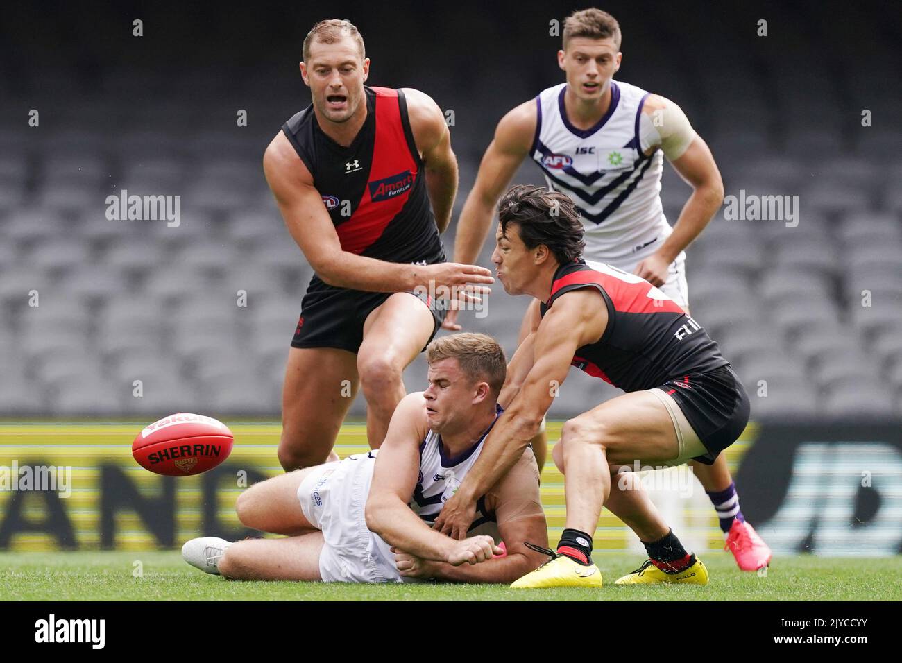 Dylan Shiel of the Bombers tackled Sean Darcy of the Dockers during the ...