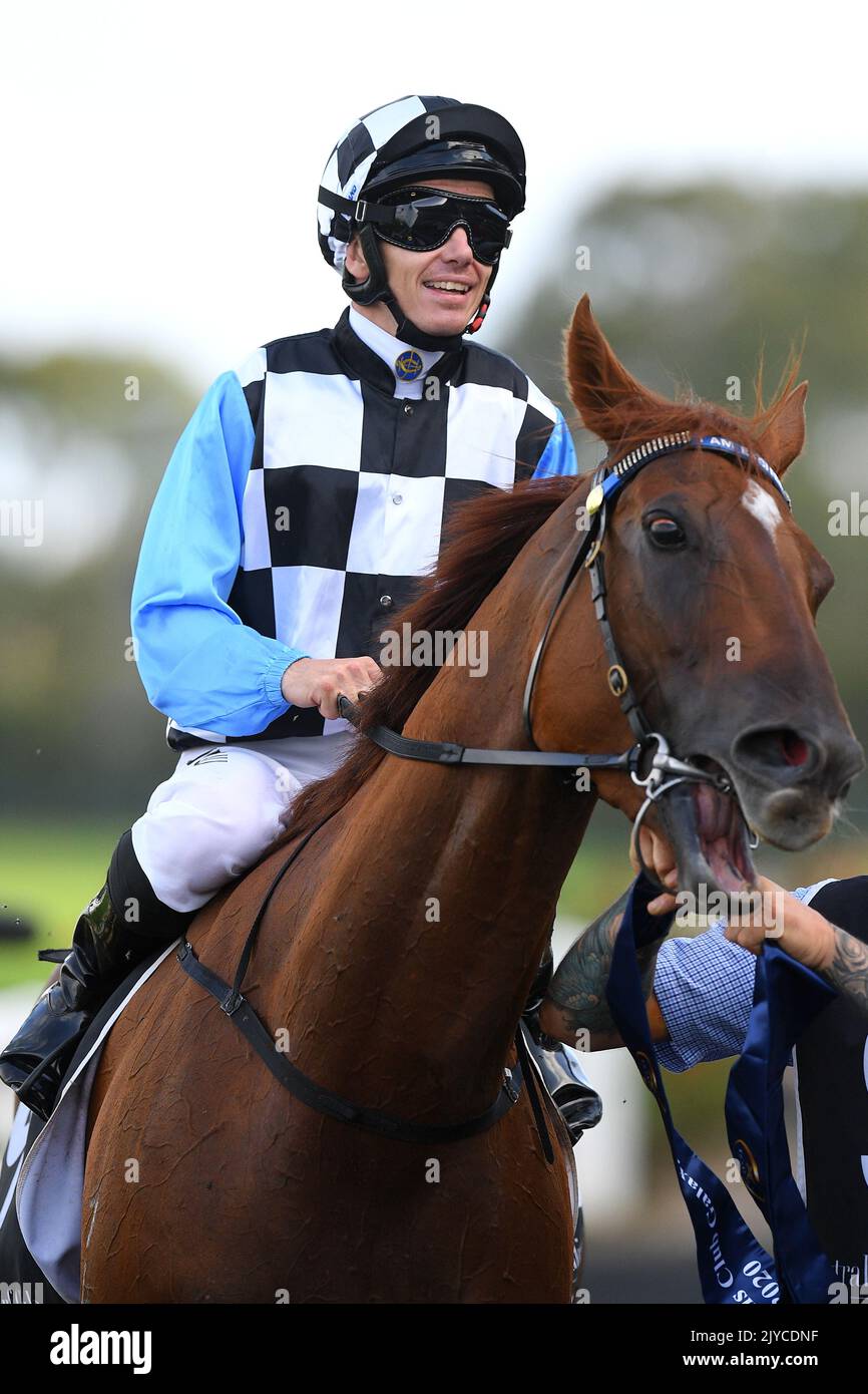 Jockey Tim Clark returns to the mounting yard after riding I Am Excited ...