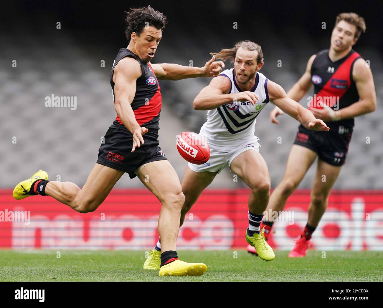 Dylan Shiel of the Bombers kicks the ball during the Round 1 AFL match ...