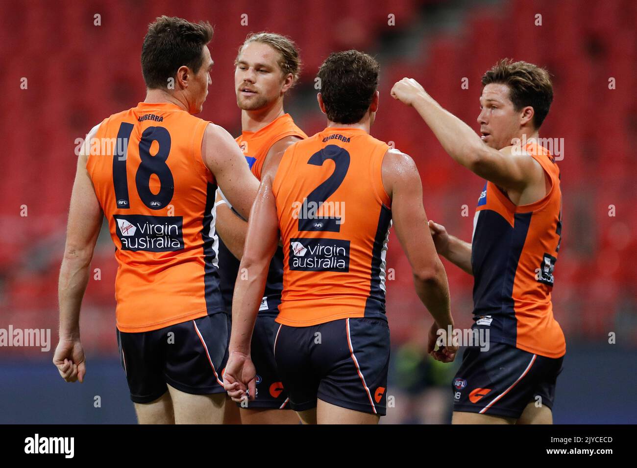 Jeremy Cameron of the Giants celebrates kicking a goal with team mates ...