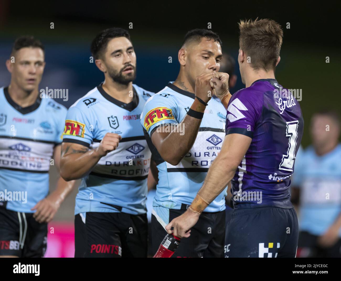 Jesse Ramien of the Sharks and Ryan Papenhuyzen of the Storm fist pump ...