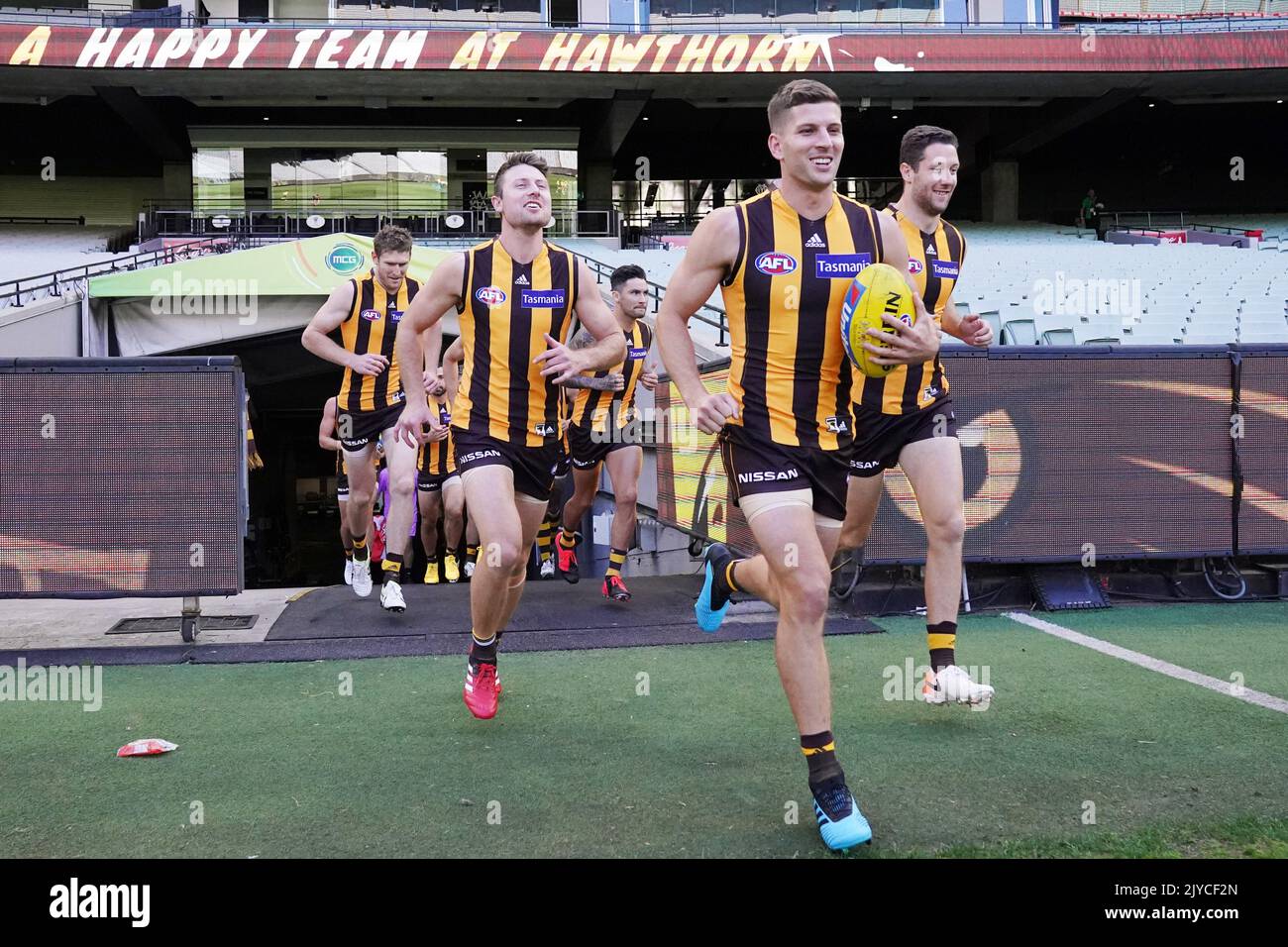 Luke Breust of the Hawks leads the team out during the Round 1 AFL ...