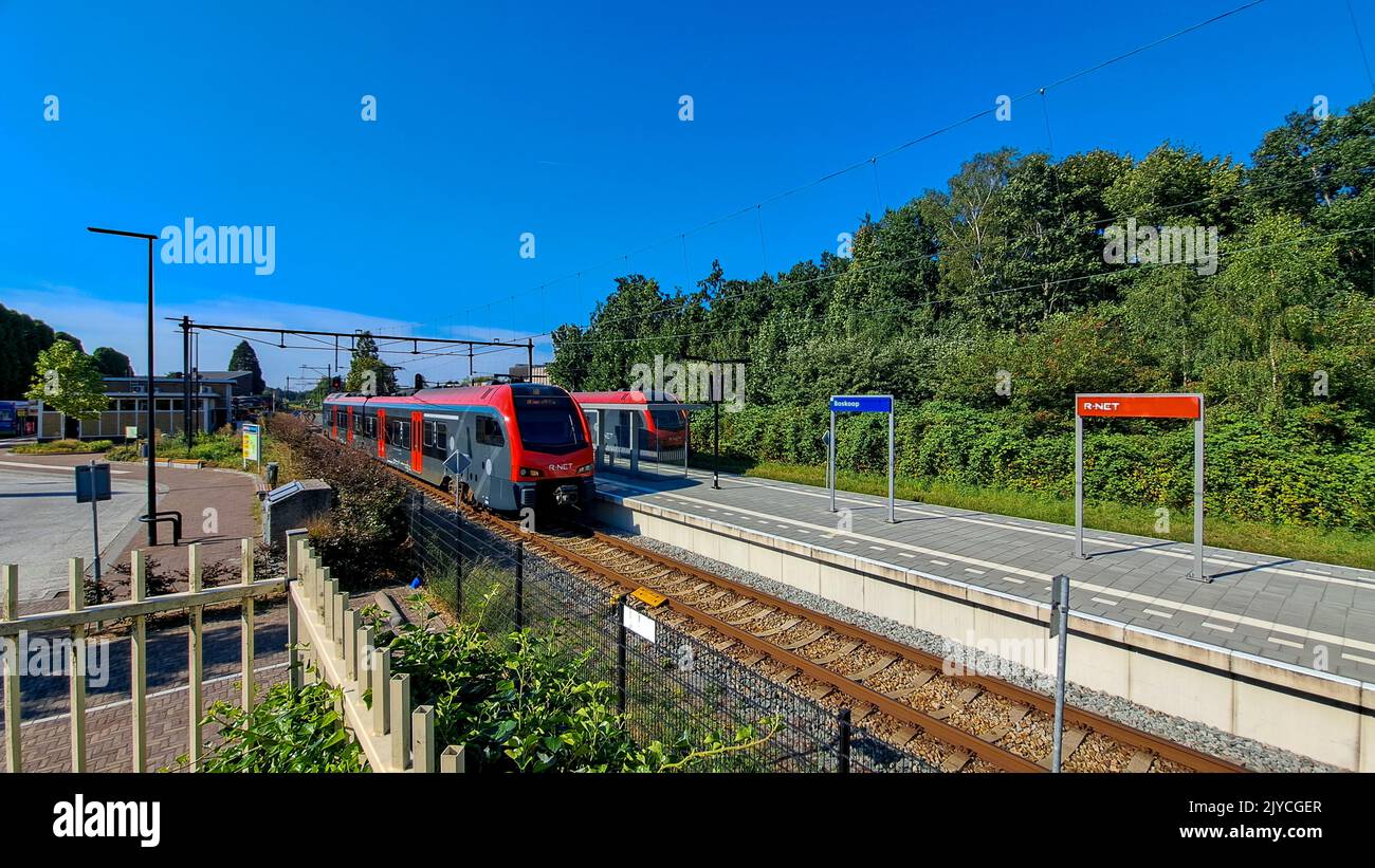 Two R-NET commuter trains are waiting on station of Boskoop between ...