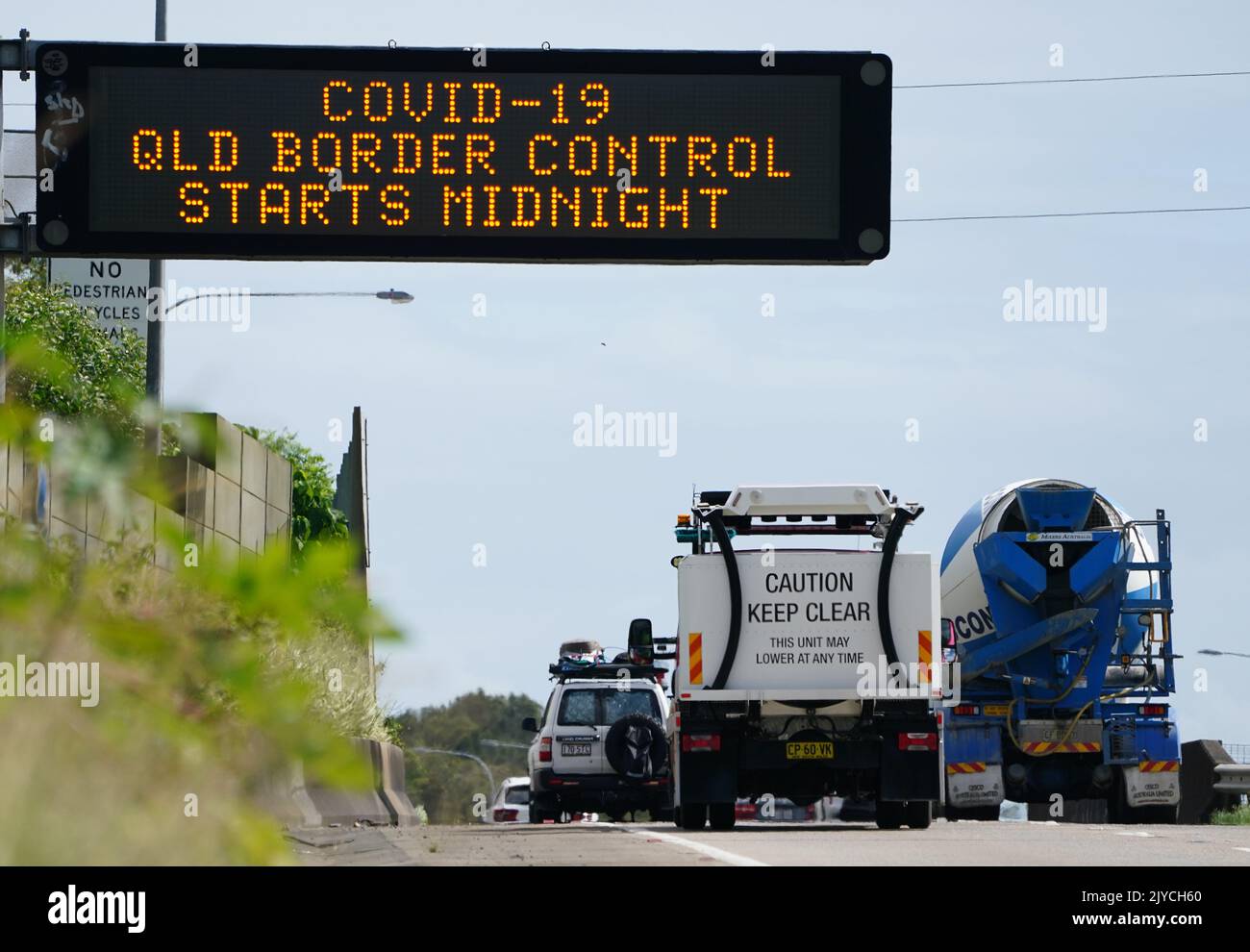 A border control sign is displayed to motorists on the Pacific Highway ...